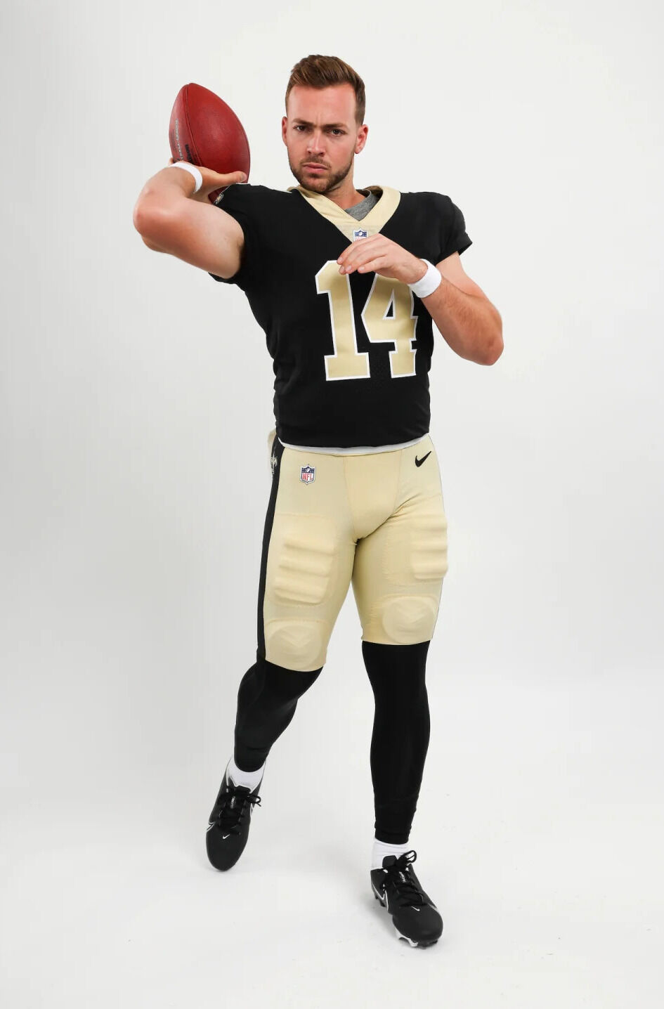 This new Saints quarterback is “serving punt” in a viral photo shoot - INTO